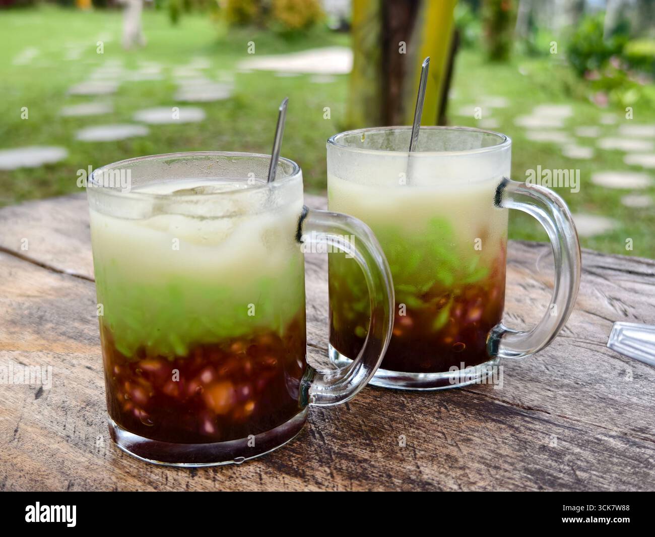 Two glasses of iced cendol, a traditional Indonesian dessert drink made ...