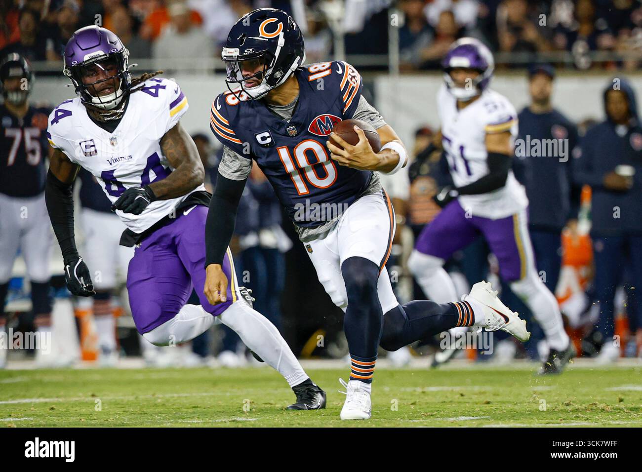 Chicago Bears quarterback Caleb Williams (18) runs with the ball ...