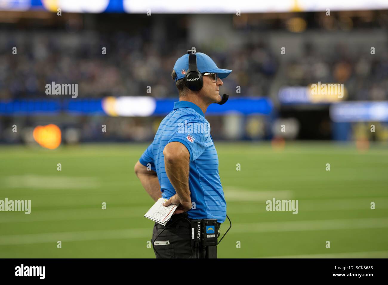 Los Angeles Chargers head coach Jim Harbaugh watches his players during ...