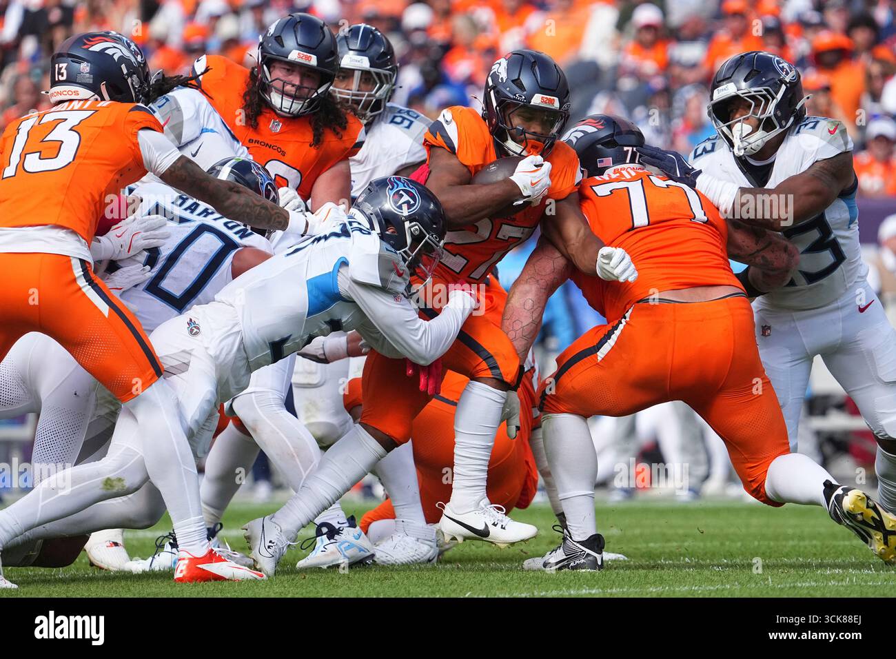 Denver Broncos running back J.K. Dobbins (27) runs the ball against the ...