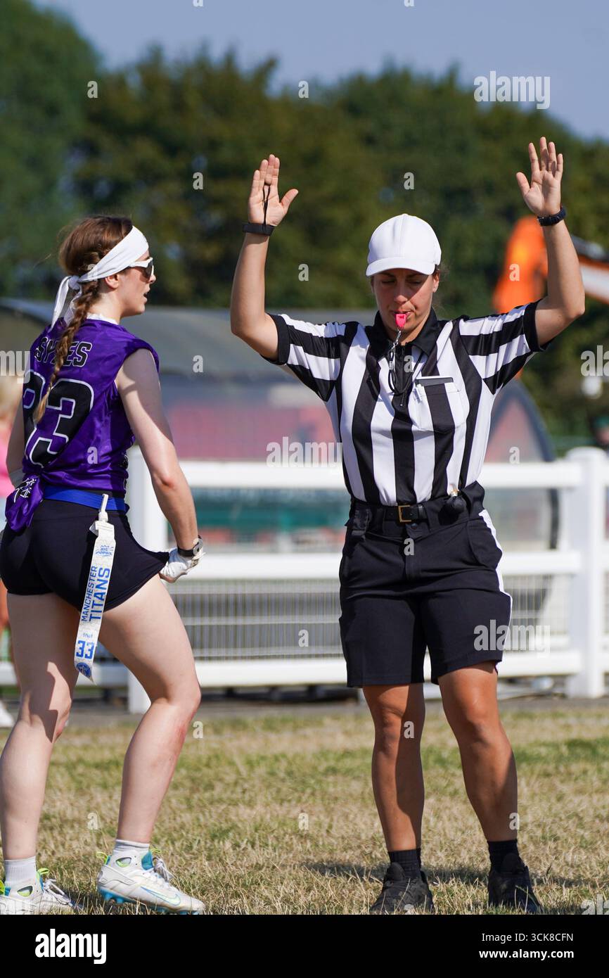 Flag football umpire signalling a touchdown Stock Photo - Alamy