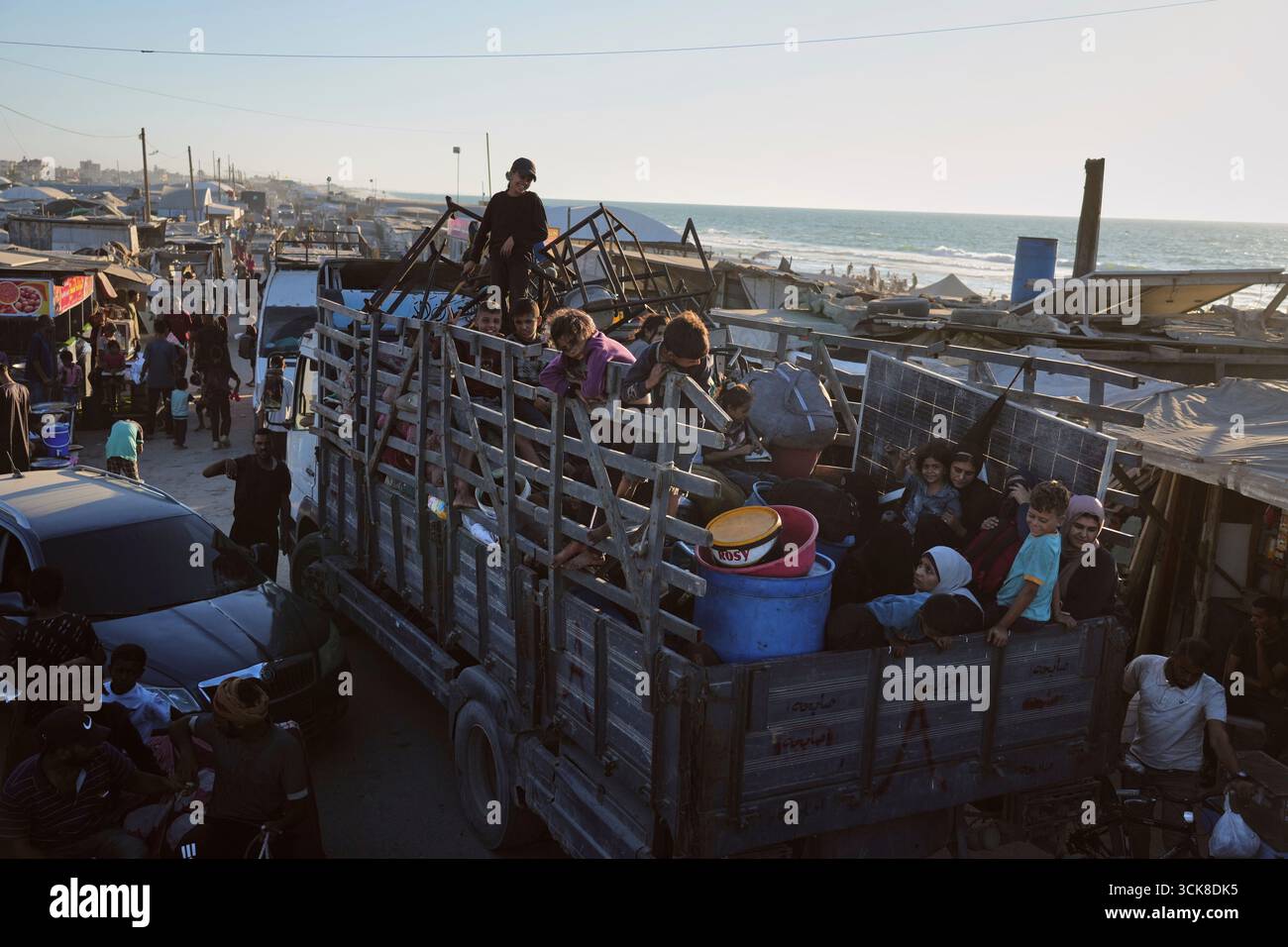 Displaced Palestinians fleeing Gaza City arrive in Muwasi, an area that ...