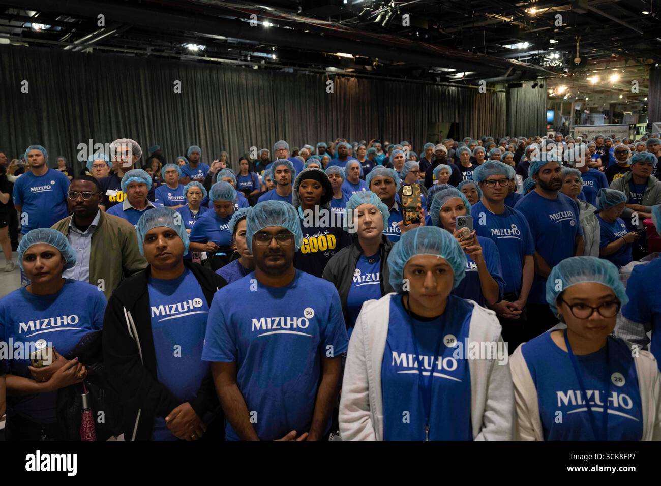 Volunteers gather for "NYC Meal Pack For 9/11 Day" at the Intrepid Sea ...