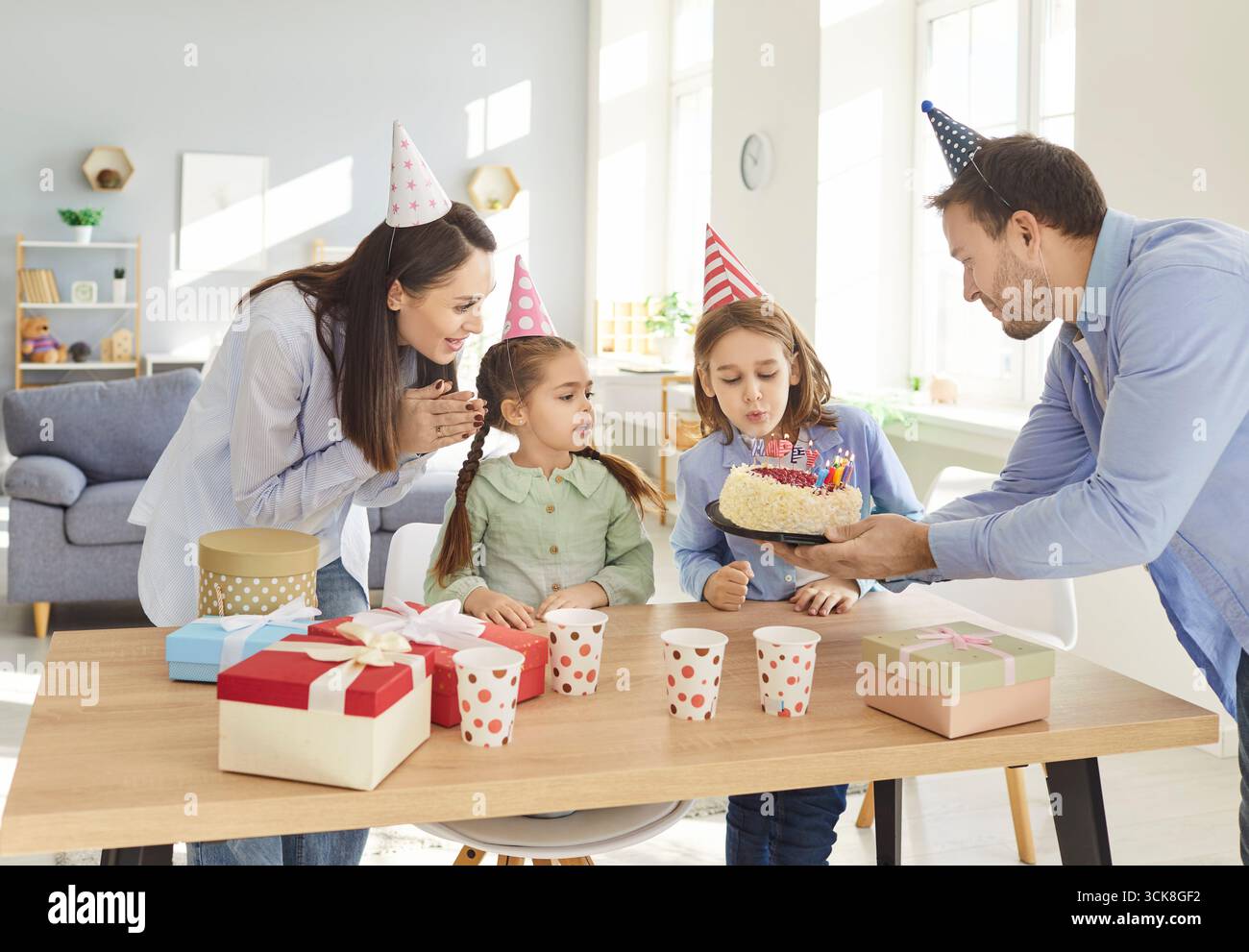 Happy birthday candle cake blowing celebration, friendly family ...