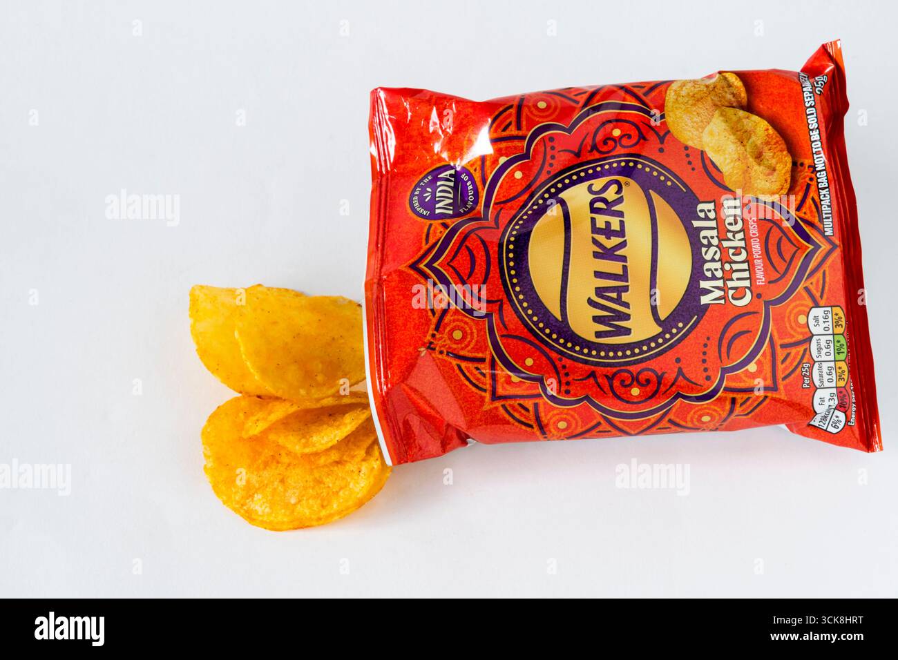 An opened packet of Walkers Masala Chicken flavoured crisps Stock Photo ...