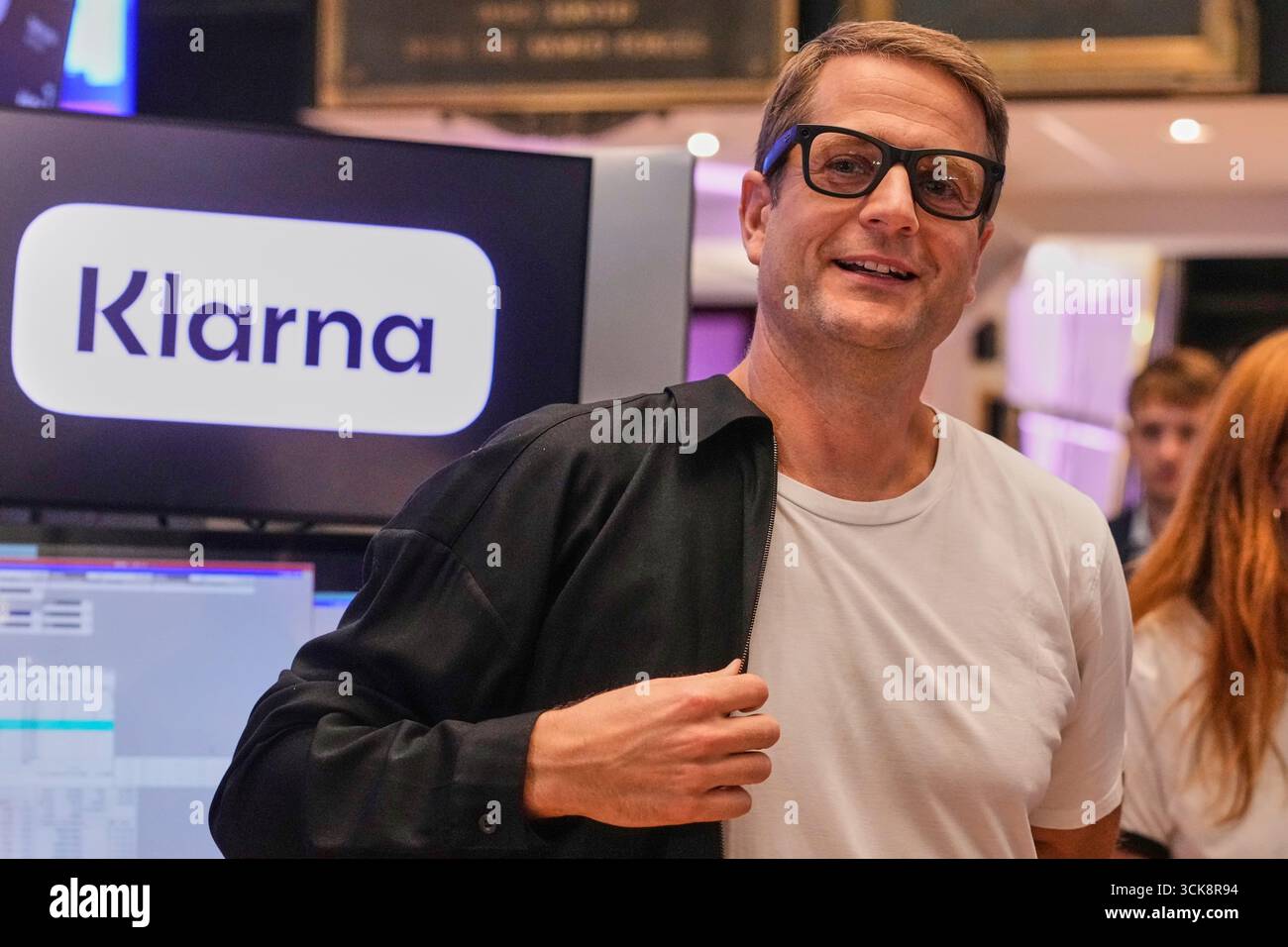 Klarna CEO Sebastian Siemiatkowski puts on his jacket on the floor of ...