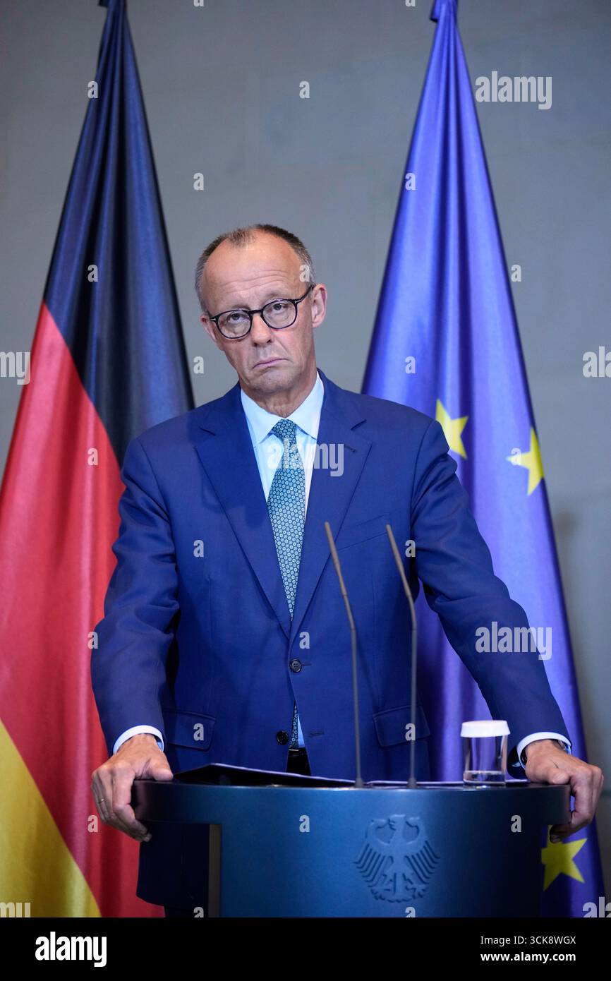 German Chancellor Friedrich Merz attends a press conference in Berlin ...