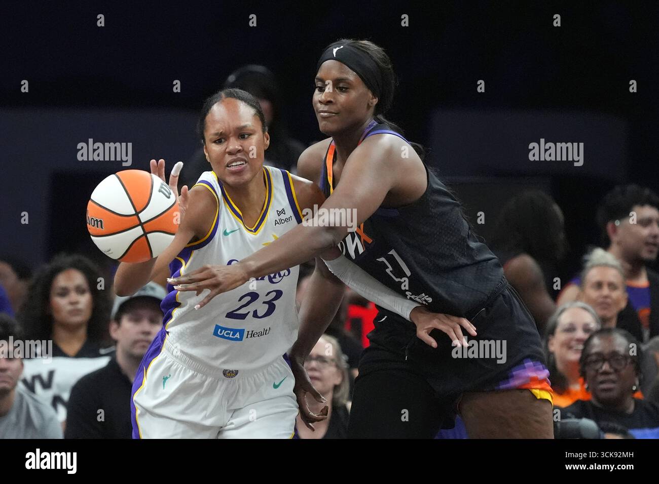 Phoenix Mercury center Kalani Brown (21) knocks the ball away from Los ...