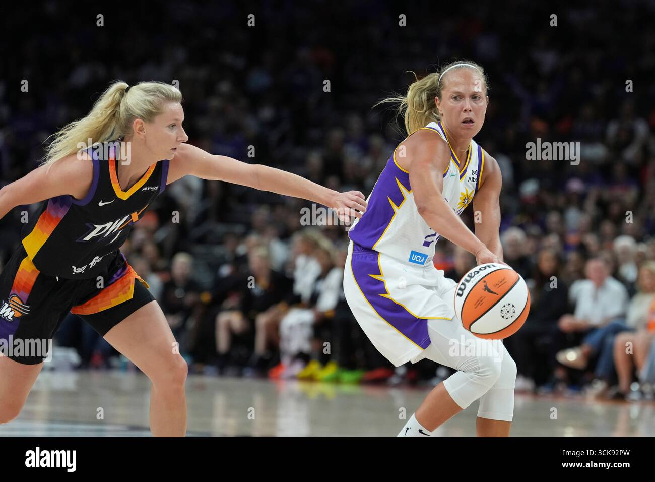 Los Angeles Sparks guard Julie Allemand, right, passes the ball against ...
