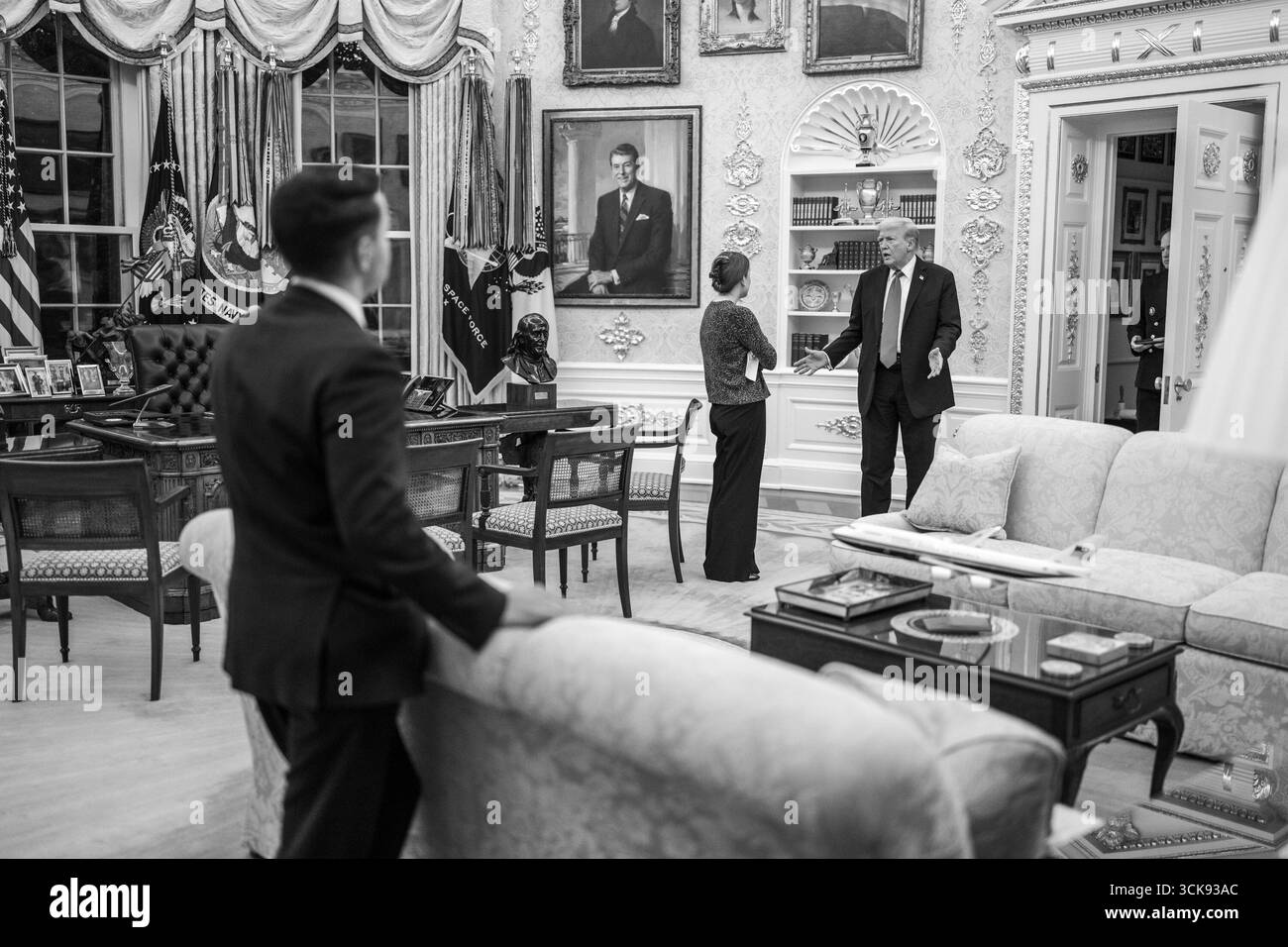 President Donald Trump speaks with Assistant to the President ...