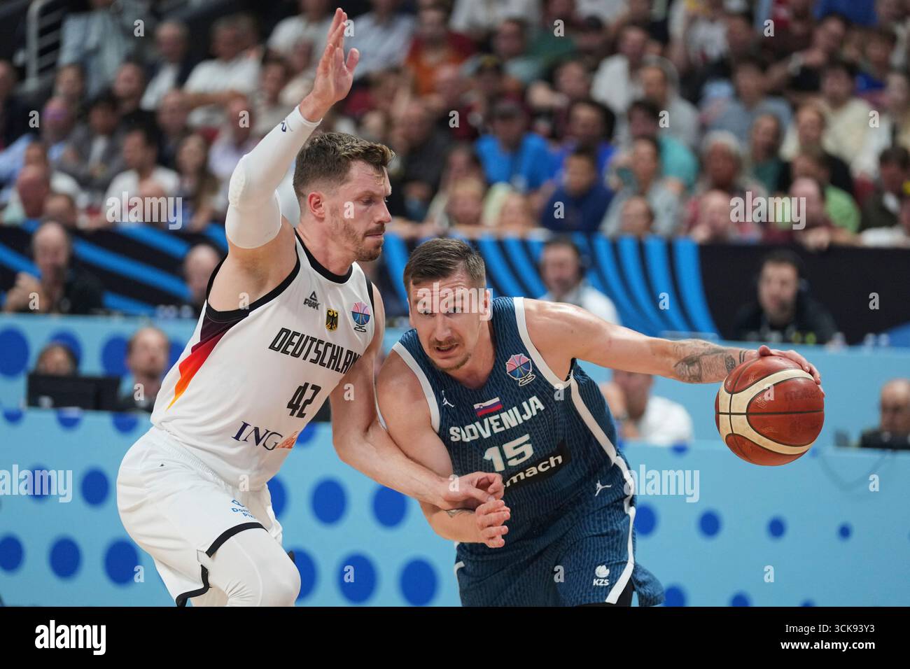 Germany's Andreas Obst, left, and Slovenia's Gregor Hrovat in action ...