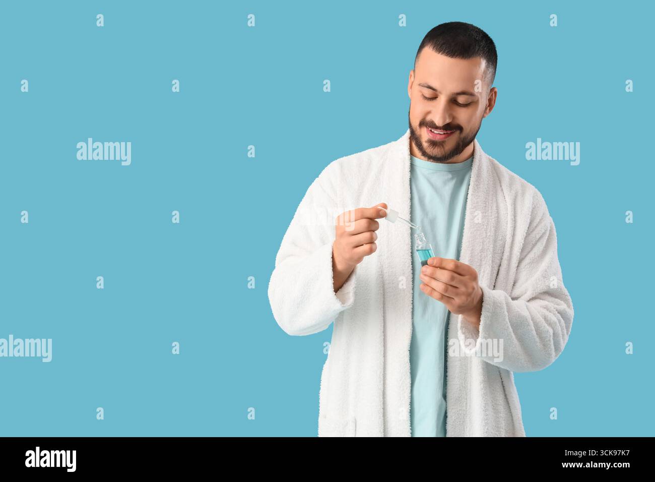 Bearded man applying blue hi-res stock photography and images - Alamy