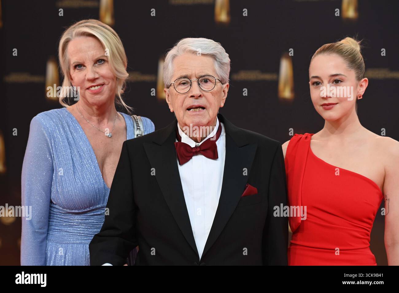 Frank ELOSTNER, showmaster, with wife Britta and daughter Enya, red ...