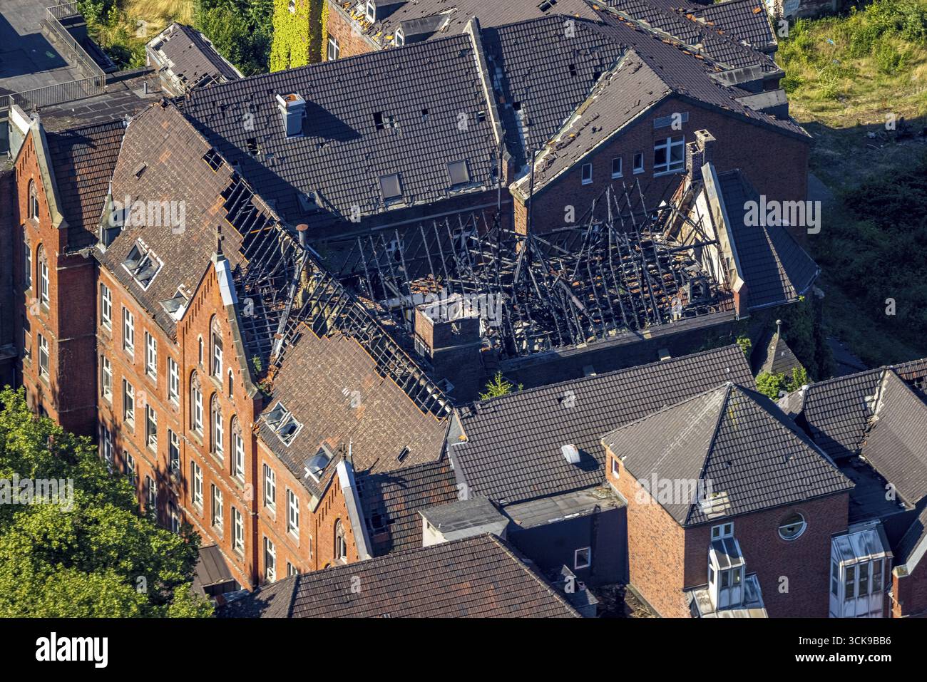 Aerial view, Former St. Barbara Hospital with fire damage to the roof ...