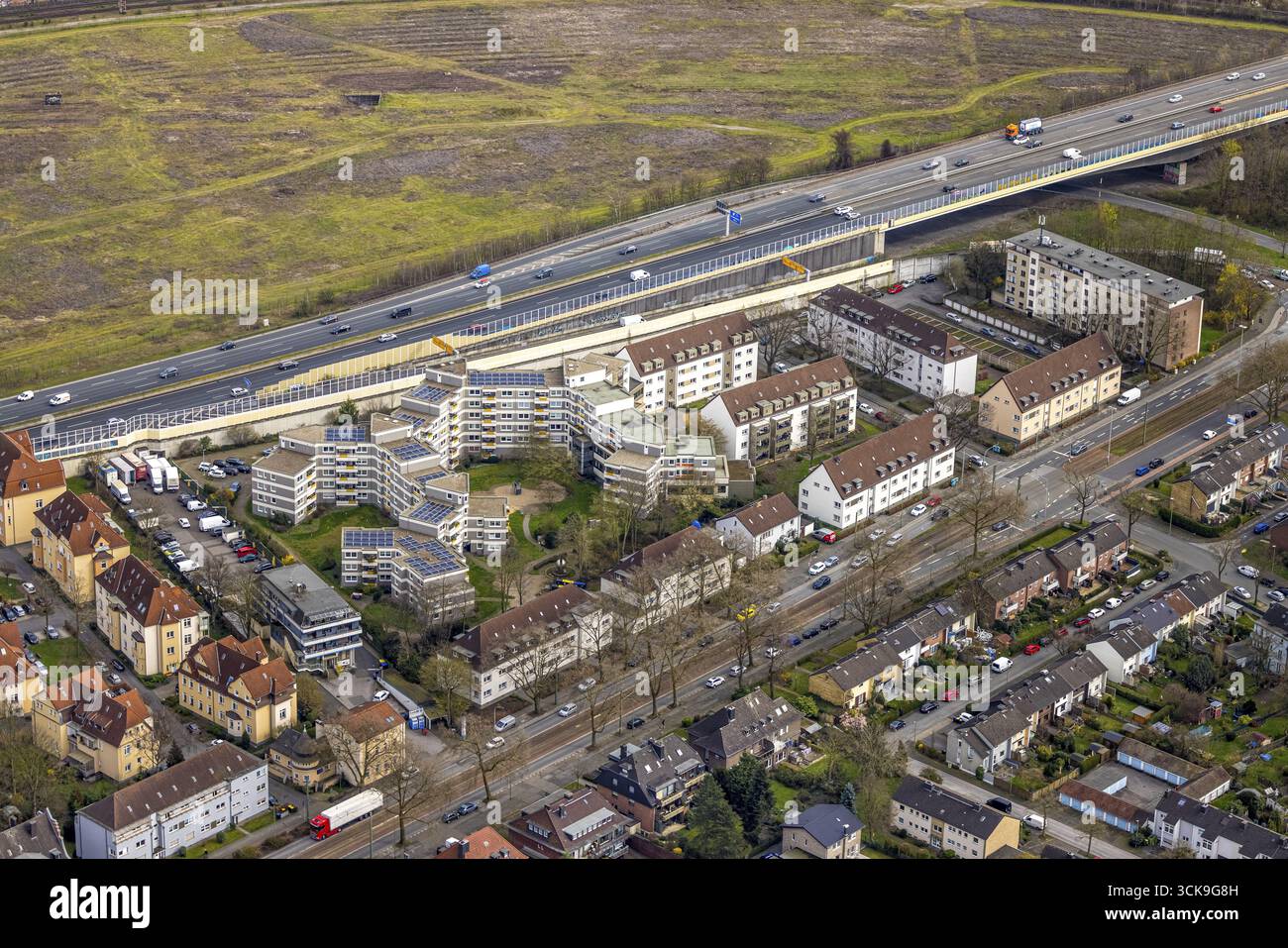 Aerial view, residential buildings with solar roof on the A59 motorway ...