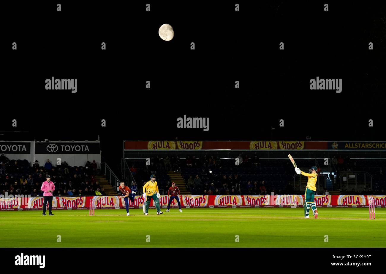 The moon is seen in the distance as South Africa's Ryan Rickelton bats ...