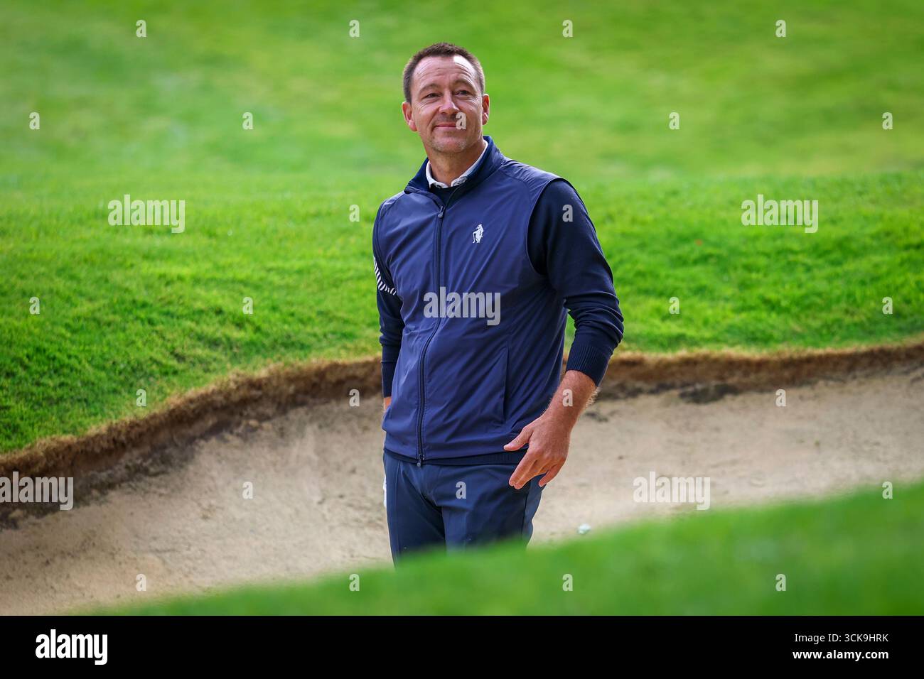 John Terry in the bunker smiling on the 18th during the BMW PGA ...