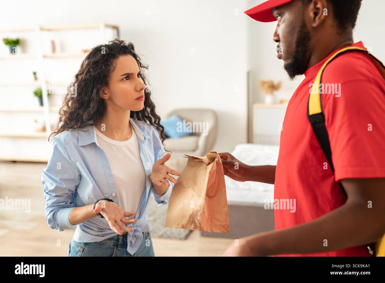 Portrait of confused angry woman complaining about bad food delivery ...