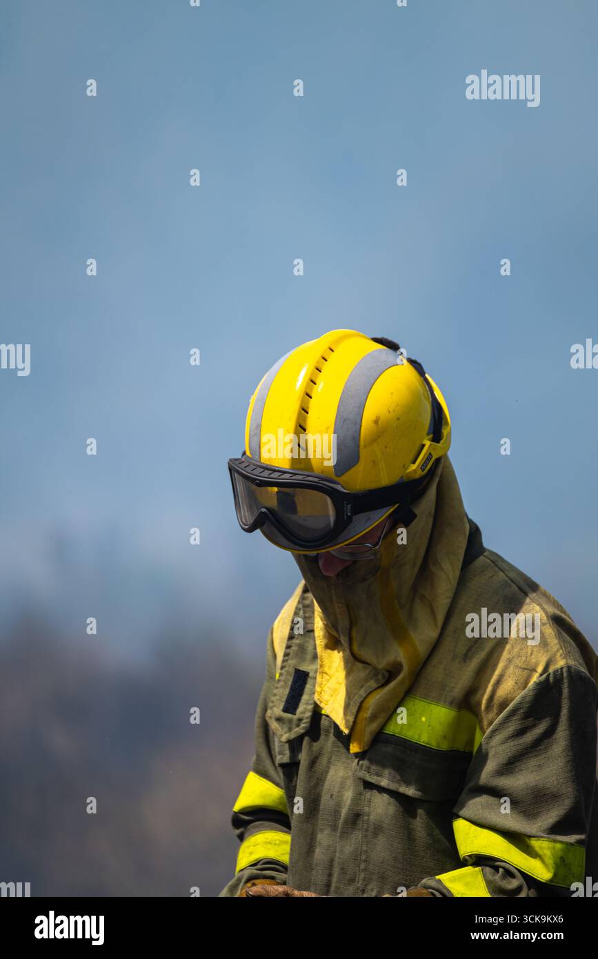 The exhaustion and dedication of a first responder after a hard job The ...