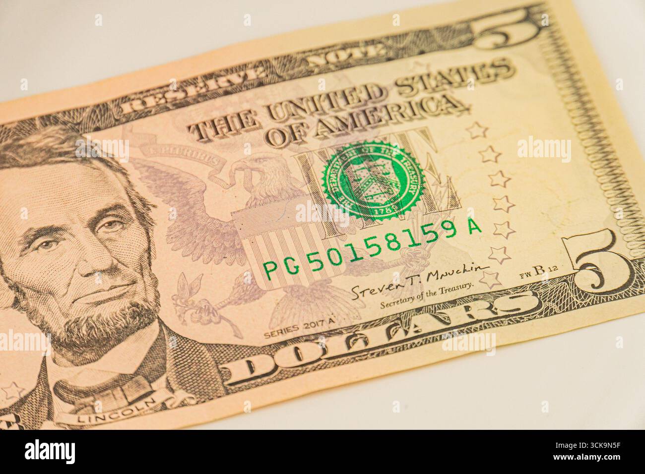 Close-up, high-resolution image of a US five-dollar bill with Abraham ...
