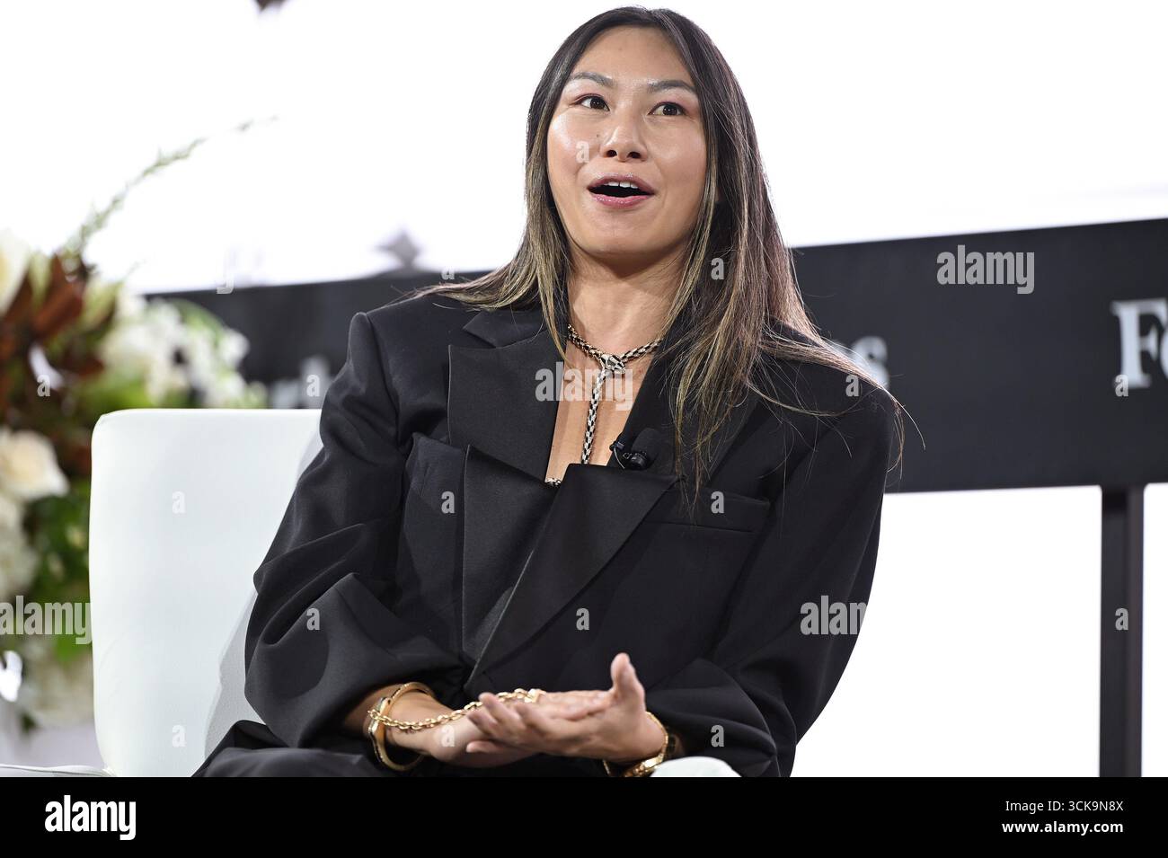 Lucy Guo, Founder & CEO, Passes, speaks at the Forbes Power Women's ...