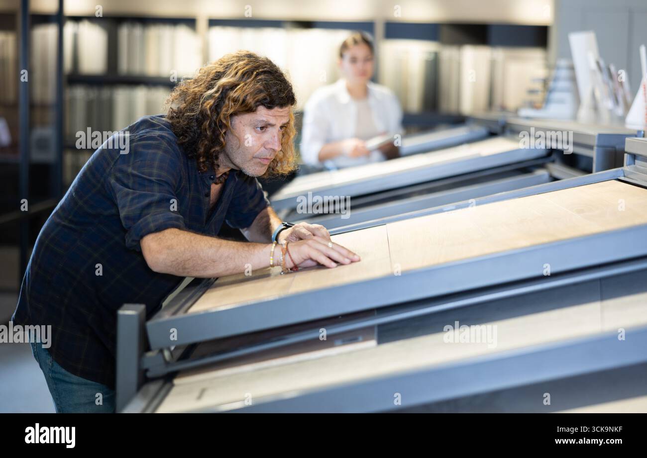 Male buyer chooses wood plywood hi-res stock photography and images - Alamy