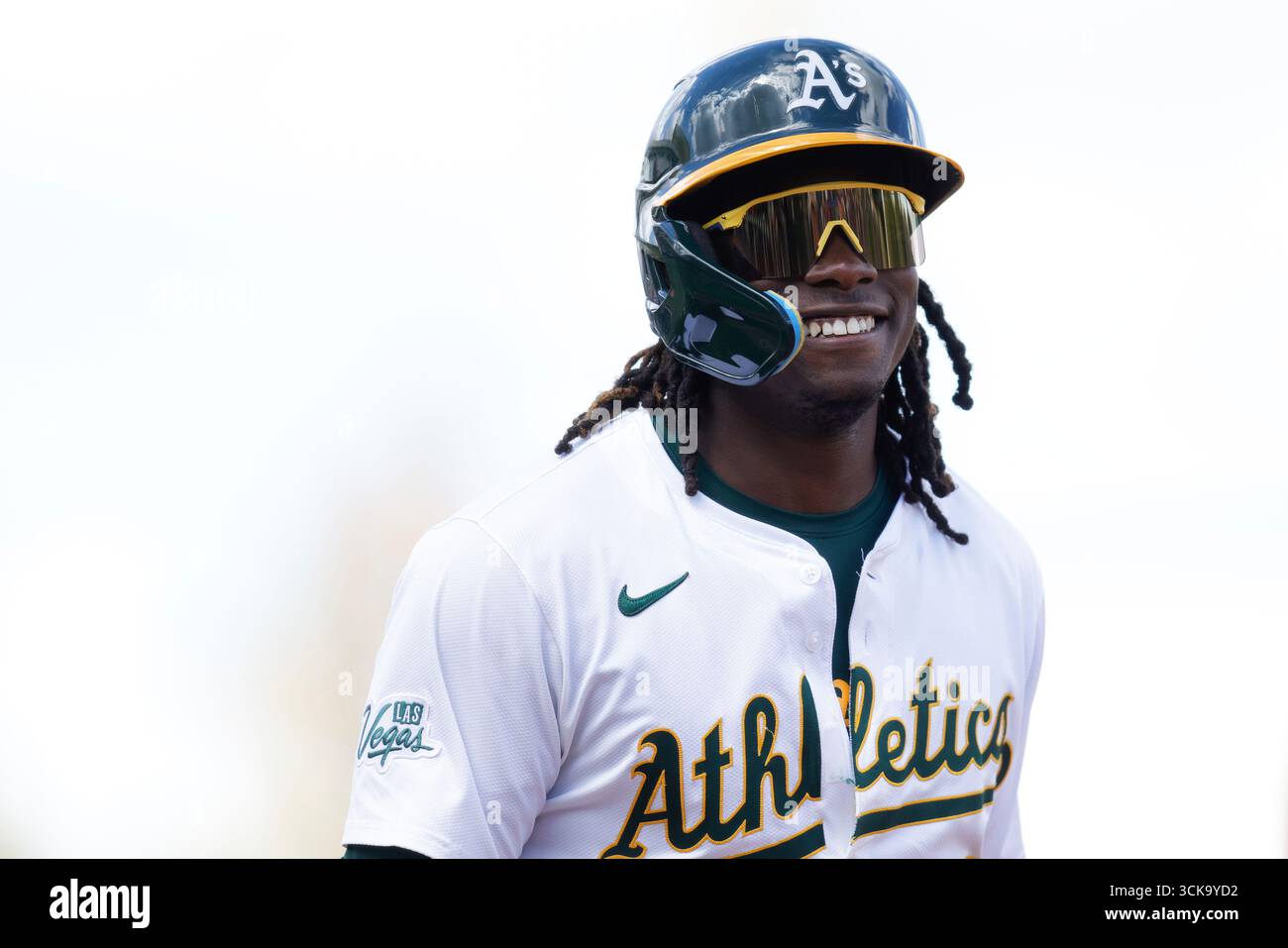 Athletics' Lawrence Butler smiles at first base during the fifth inning ...