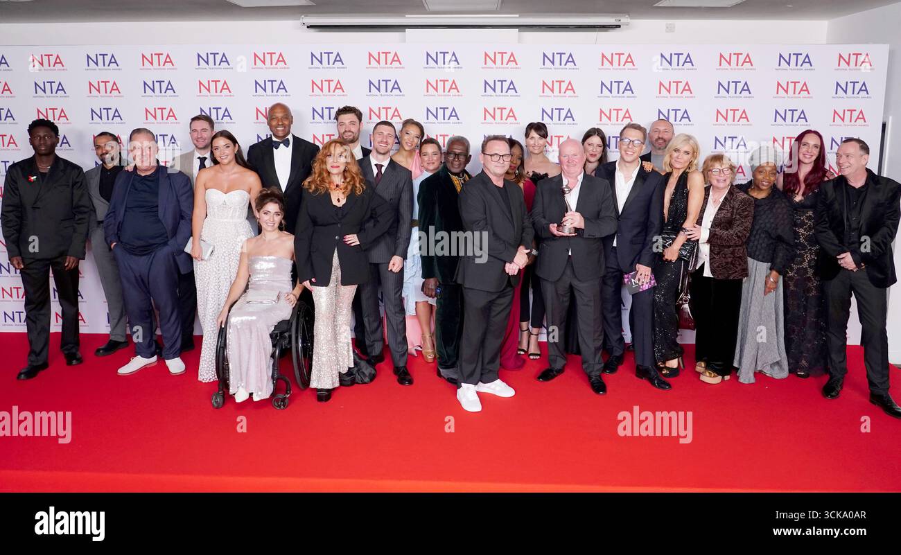 The Eastenders cast and crew in the press room after the soap won the ...