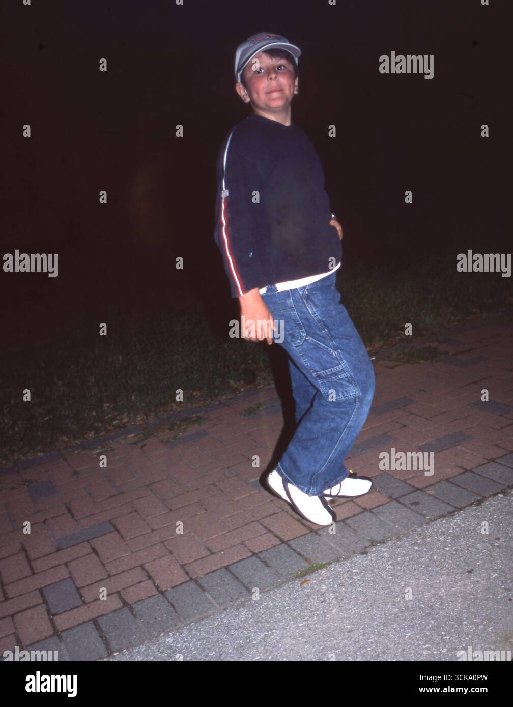 3rd grade boy walking on sidewalk ©2002 Stock Photo - Alamy