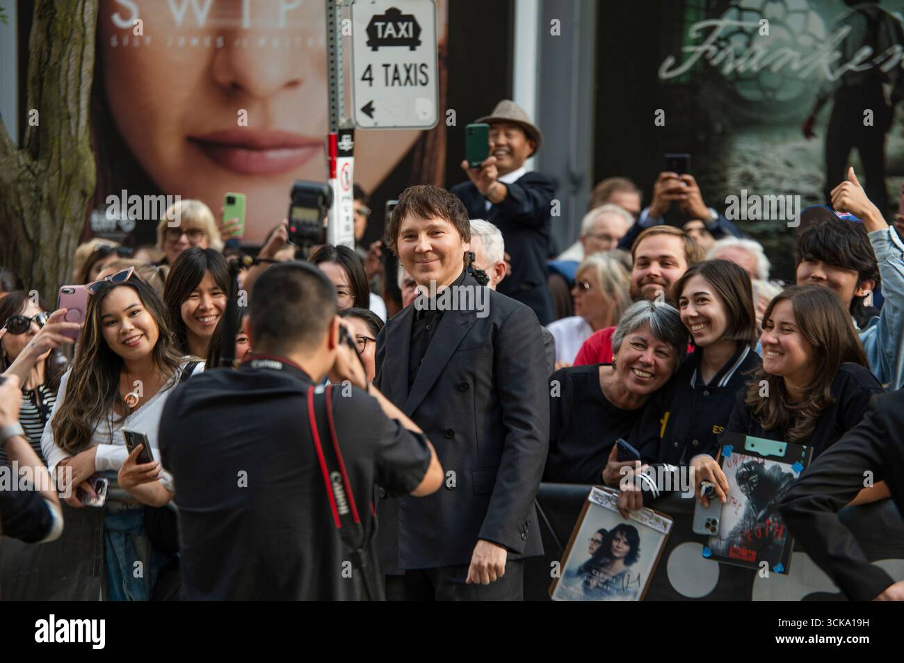 Paul Dano greets fans before the red carpet for "The Wizard of the ...