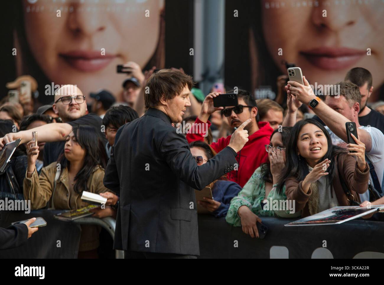 Paul Dano greets fans before the red carpet for "The Wizard of the ...