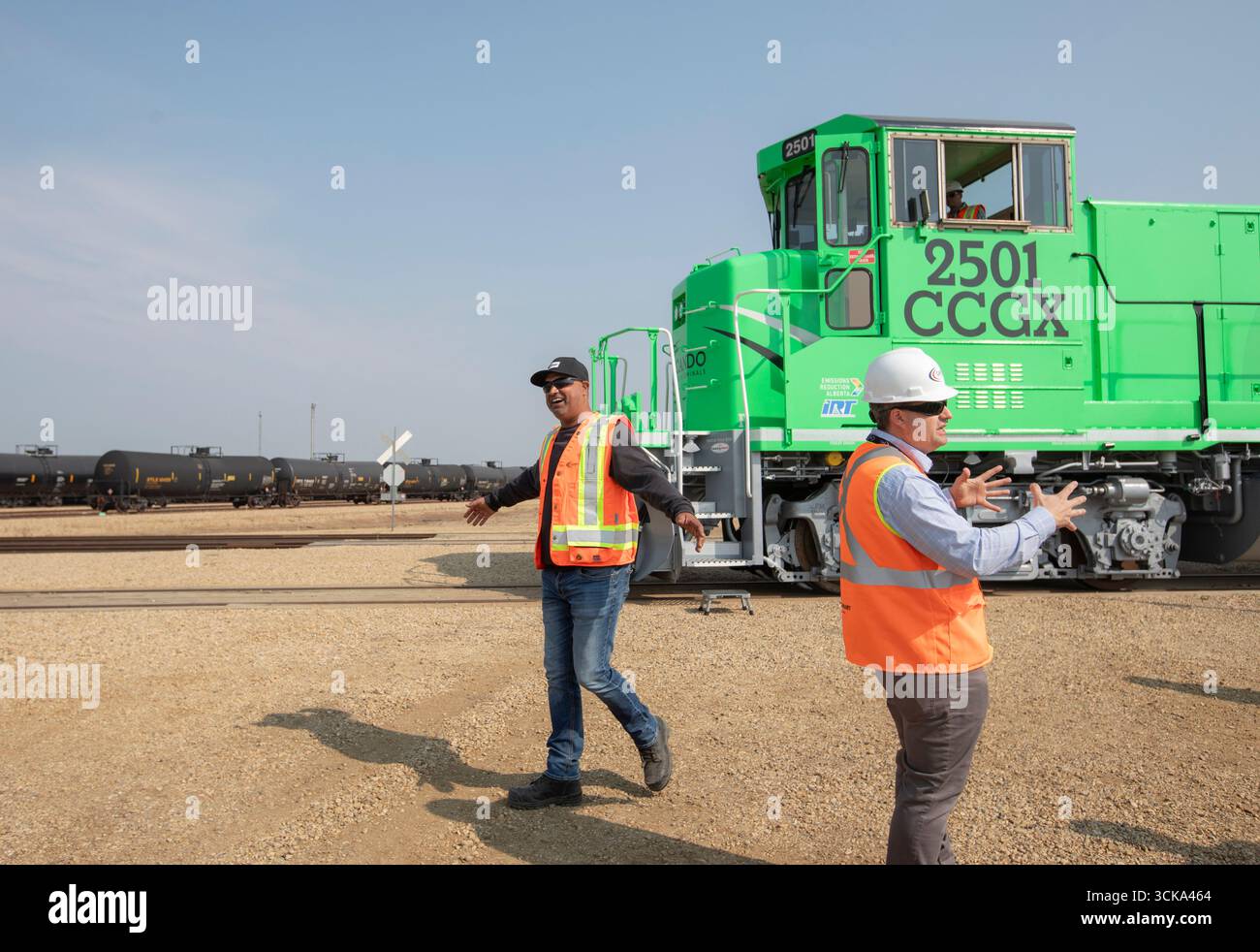 People look over the first ever lithium-ion battery-powered switching locomotive after it was ...