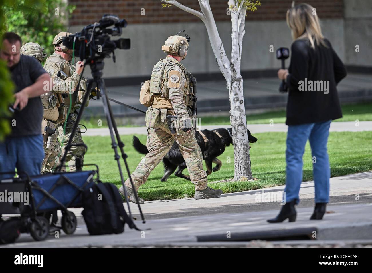 Law enforcement officials patrol the Utah Valley University campus as a ...