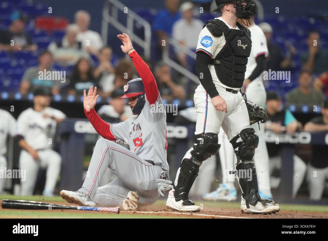 Washington Nationals' Brady House (55) scores on a hit by Robert ...
