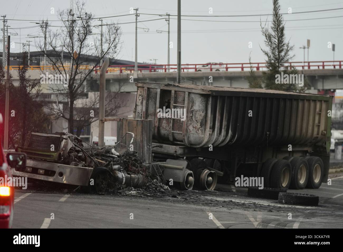 A damaged truck sits at the scene of a gas tanker explosion in Mexico ...