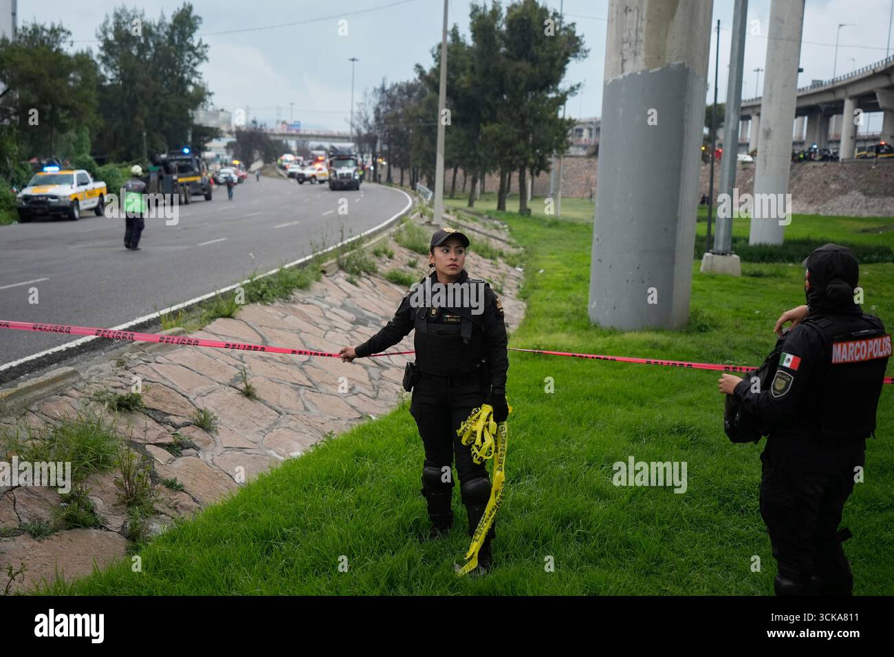 Police cordon off a road after a gas tanker exploded in Mexico City ...
