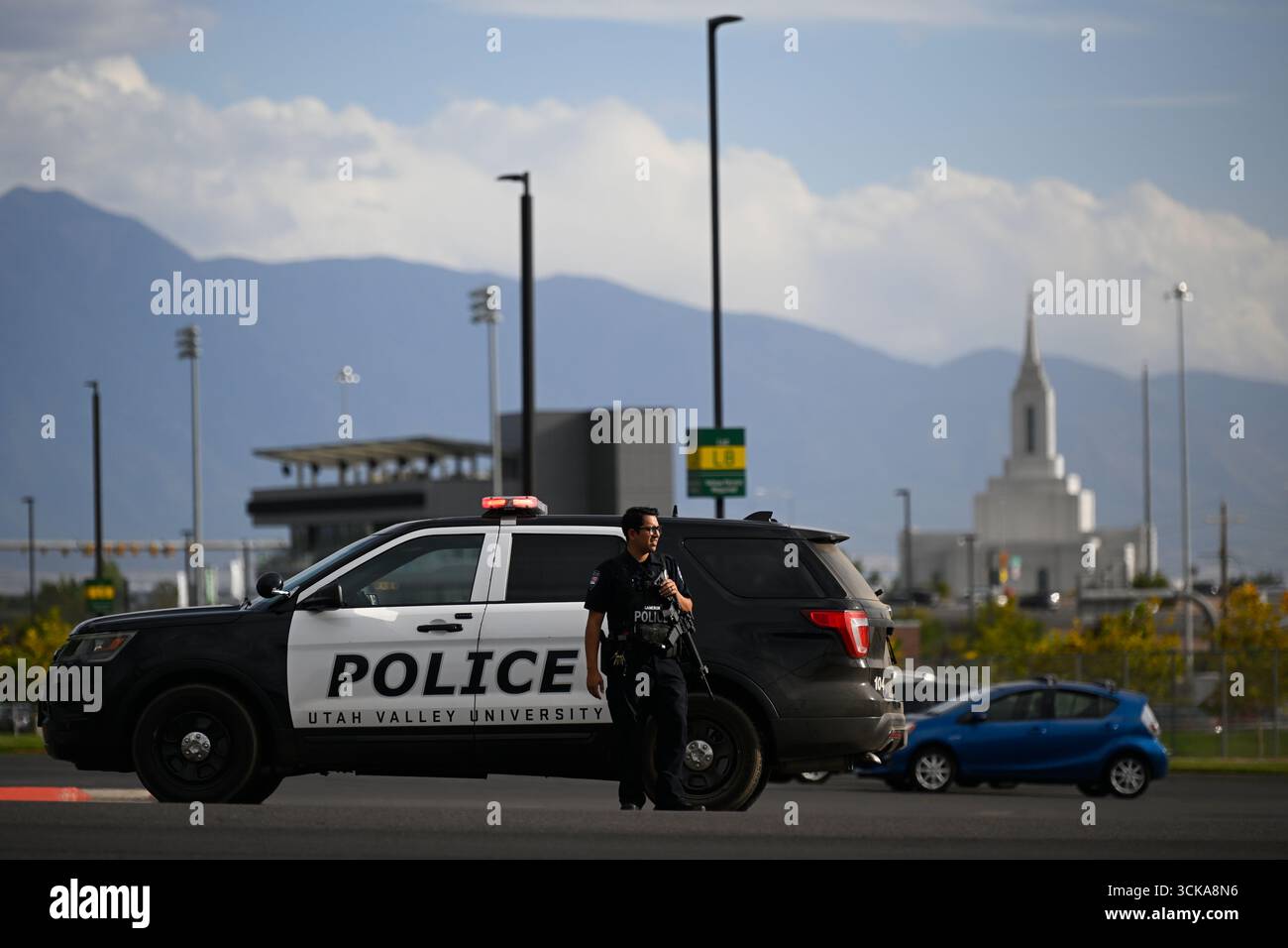 A law enforcement officer stands outside Utah Valley University on ...