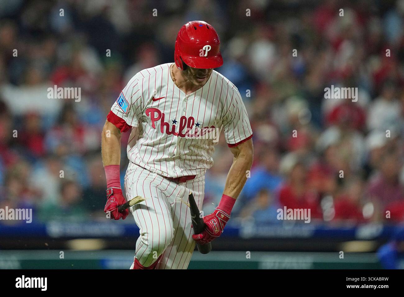 Philadelphia Phillies' Max Kepler breaks his bat over his knee after ...