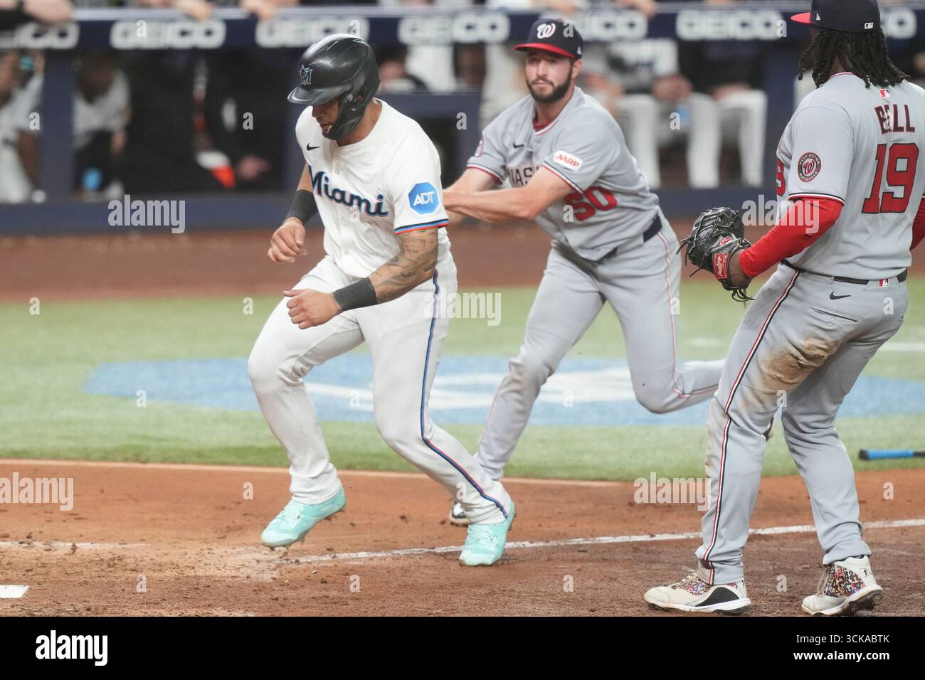 Washington Nationals pitcher PJ Poulin (50) tags Miami Marlins' Agustín ...