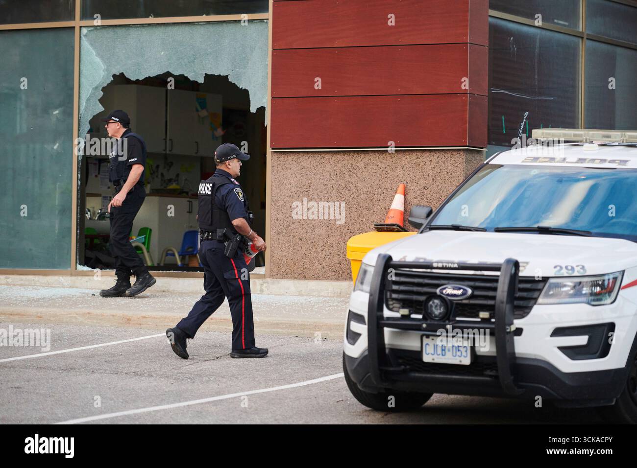 Police assess the damage at First Roots Early Education Academy after a ...