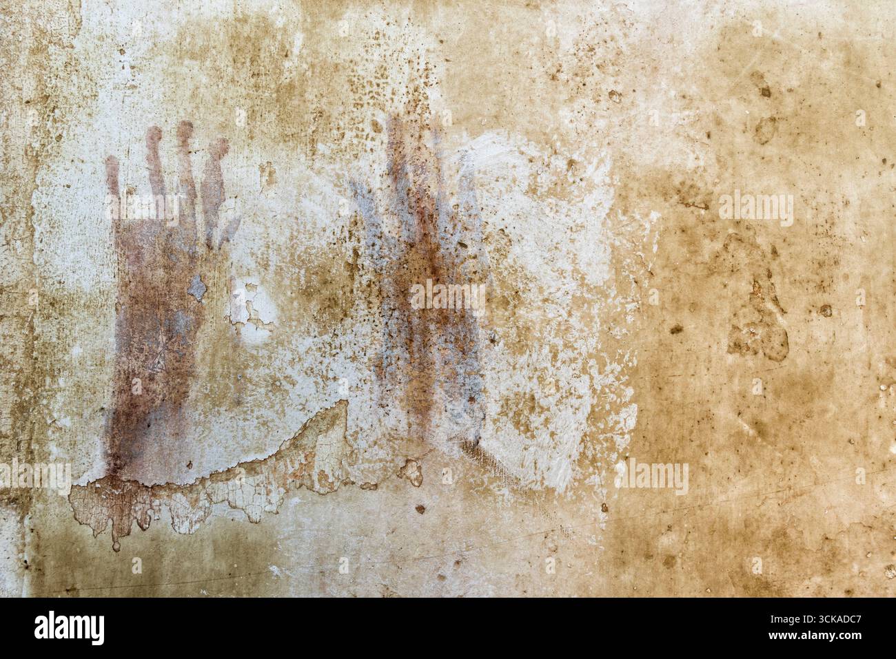 Pareidolia, reddish hand markings on old wall resembling a crime scene ...