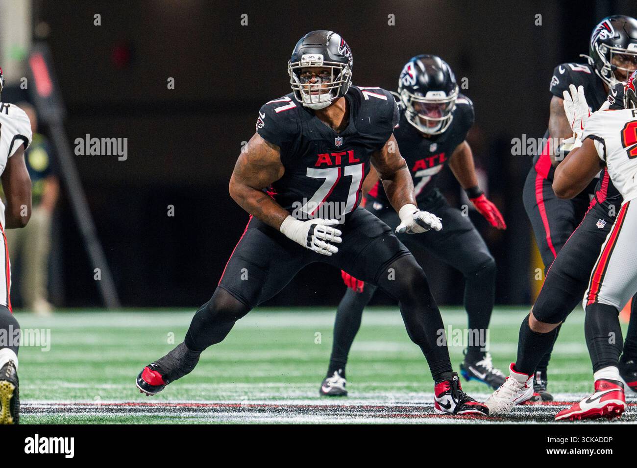 Atlanta Falcons offensive tackle Elijah Wilkinson (71) works during the ...