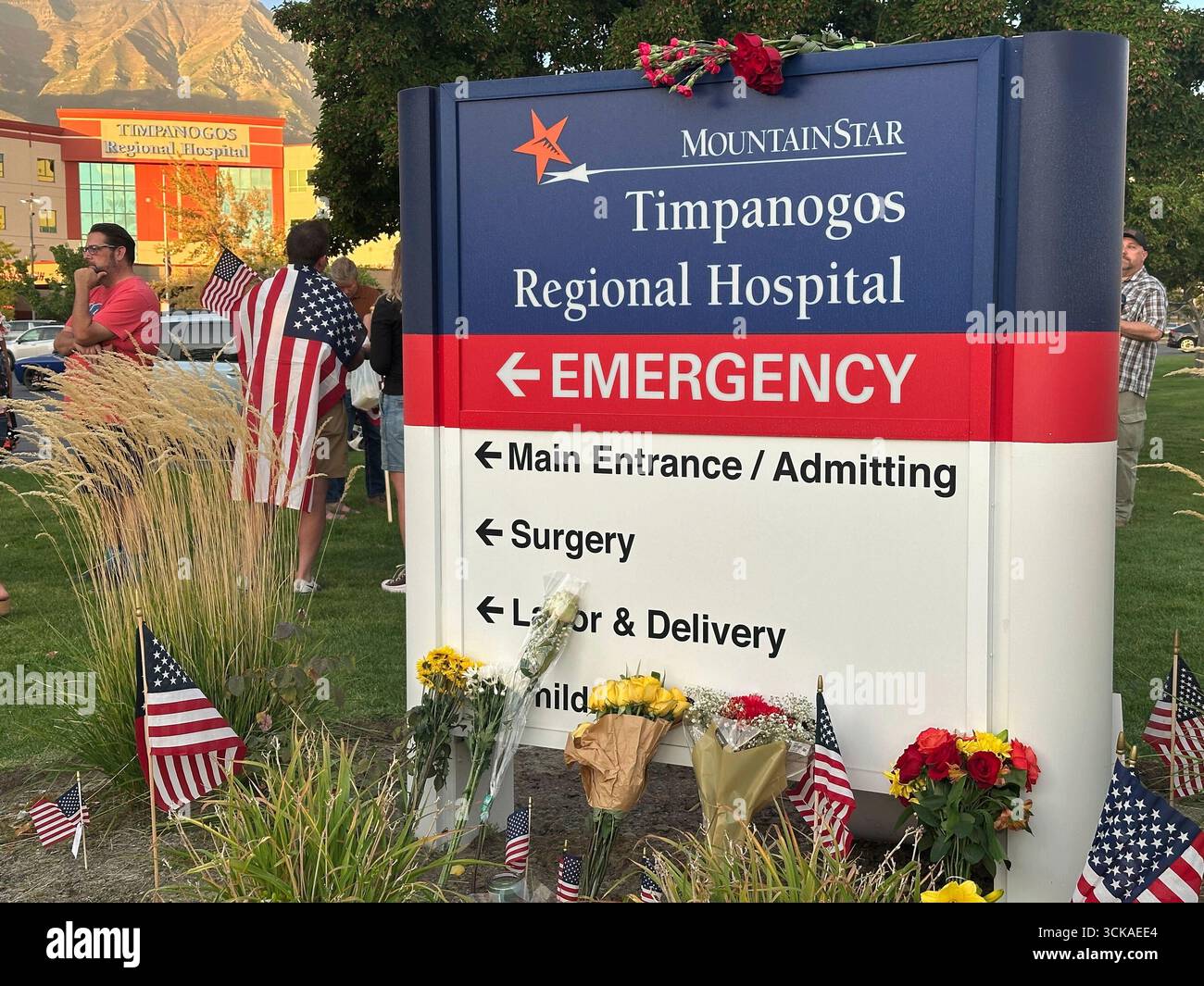 Flowers rest next to a sign for Timpanogos Regional Hospital after ...