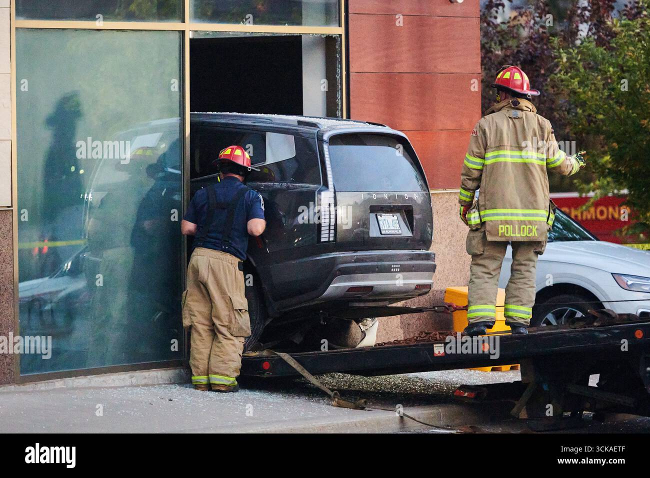 Police and fire crews work to remove a vehicle from First Roots Early ...