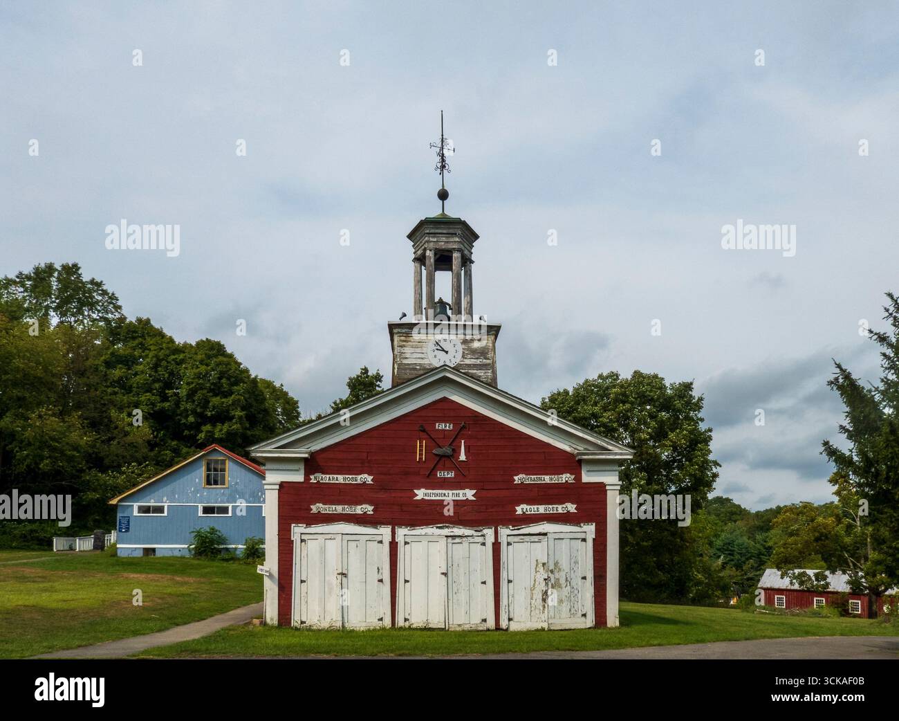 Monroe, NY - US - Sep 6, 2025 A historic red firehouse with a bell ...