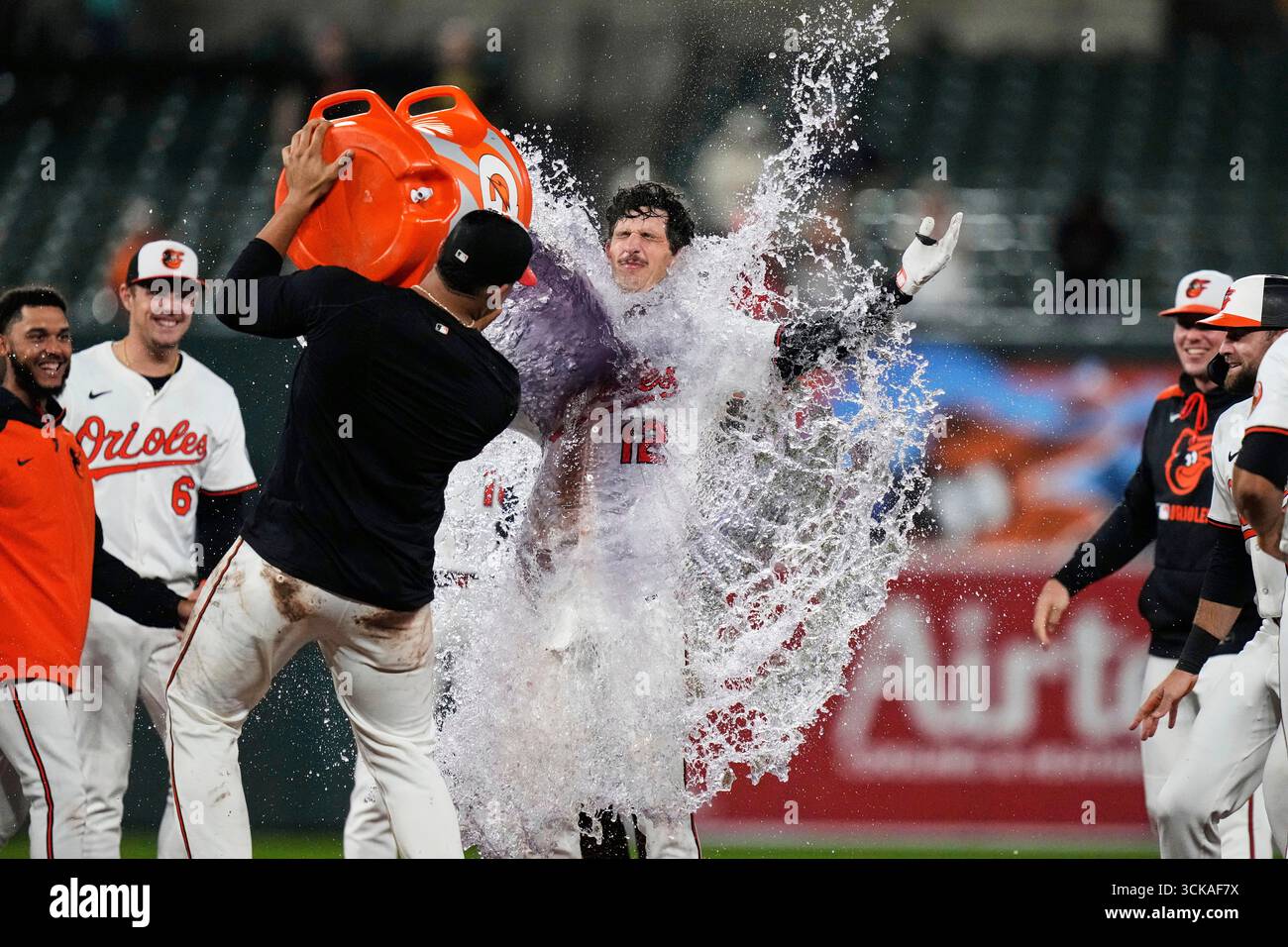 Baltimore Orioles' Dylan Beavers (12) is doused after hitting a walk-off single during the 10th ...