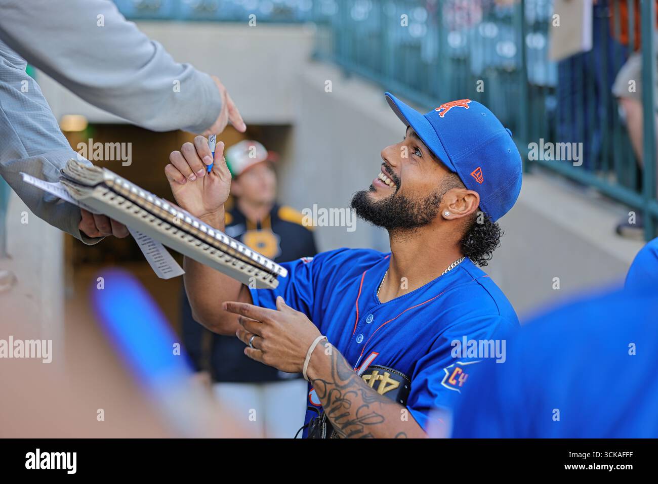Greensboro, NC: Brooklyn Cyclones pitcher Eduardo Herrera (45) signs ...