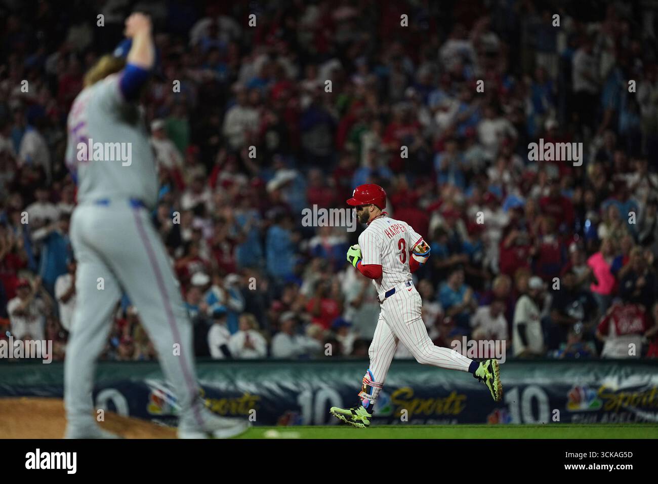 Philadelphia Phillies' Bryce Harper, right, runs the bases after ...