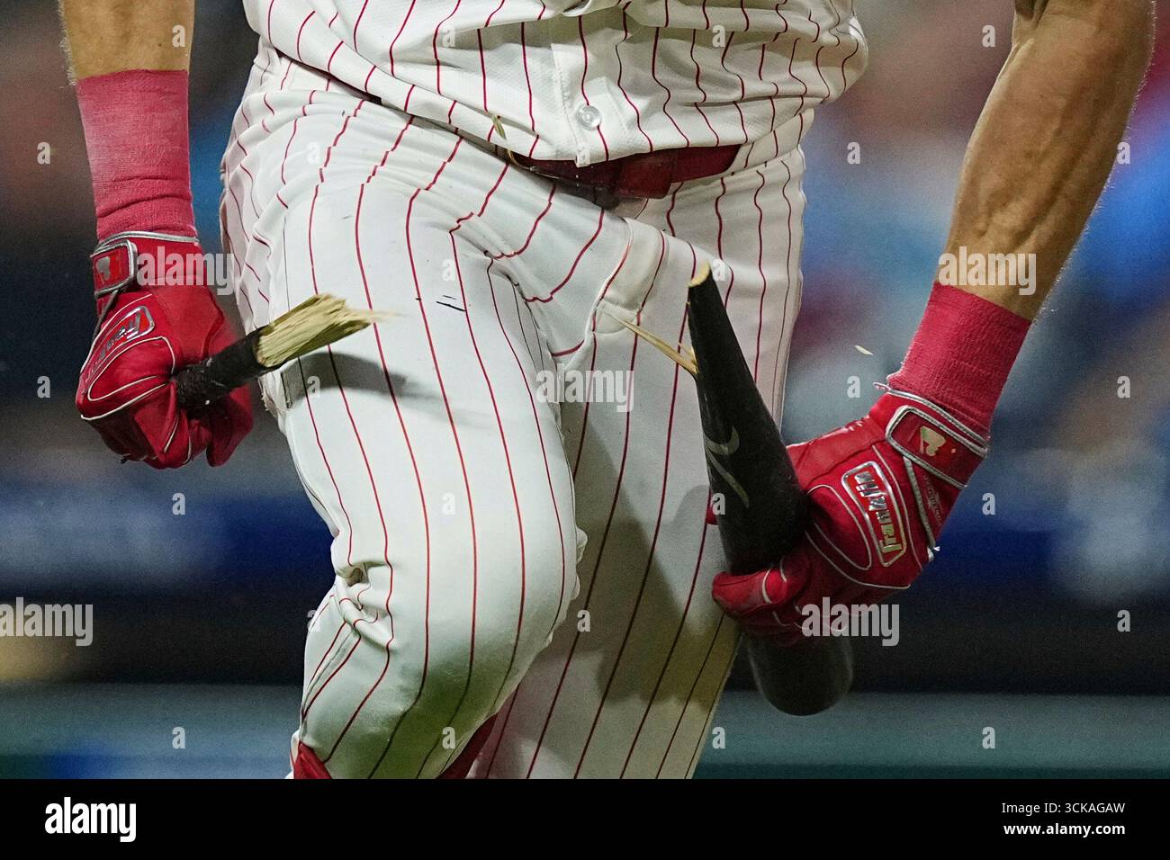Philadelphia Phillies' Max Kepler breaks his bat over his knee after ...