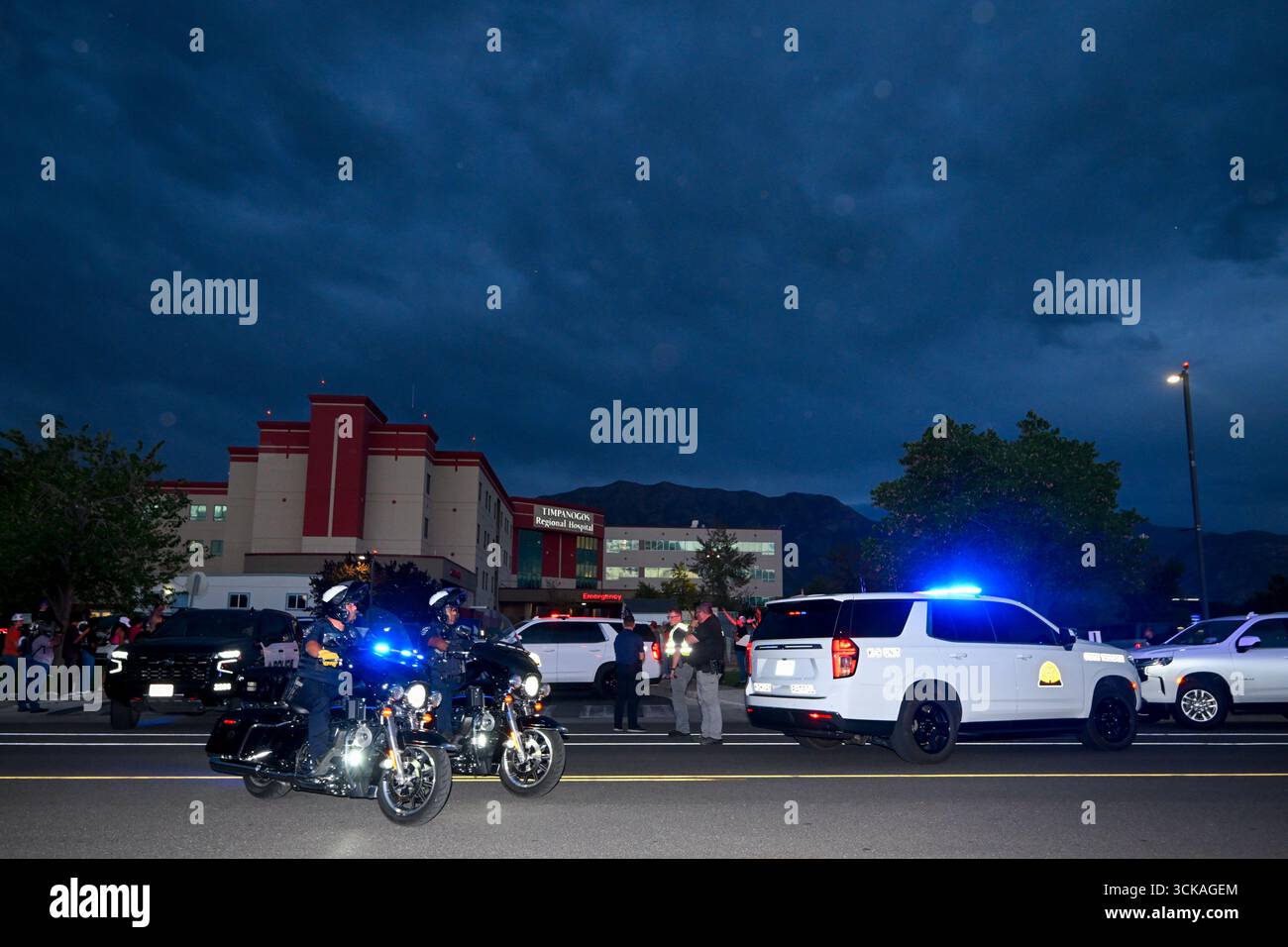 A law enforcement caravan leaves Timpanogos Regional Hospital on ...